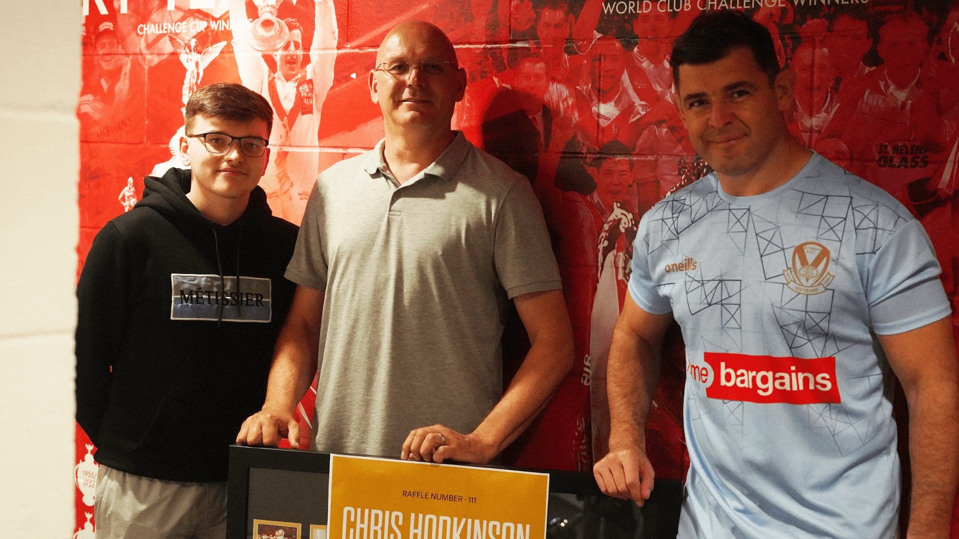 Raffle Winner alongside Paul Wellens adds to our Honours Wall - Saints TV